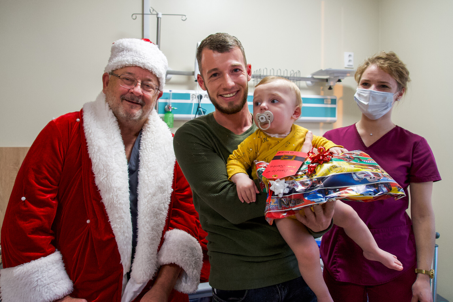 CCI Dr Novick dressed as Santa post surgeries with patient his father ...