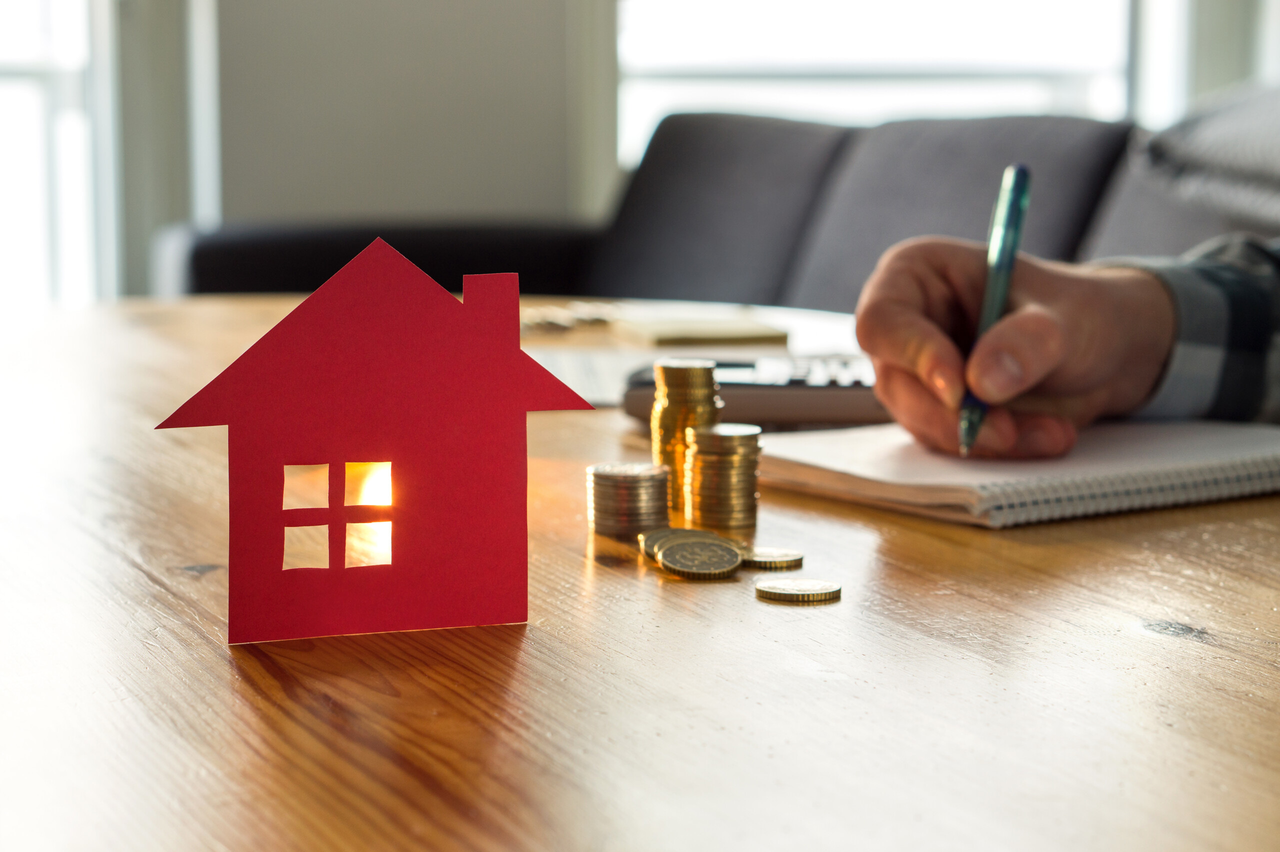 bigstock-Man-Counting-House-Price-Home-232467577-scaled.jpg