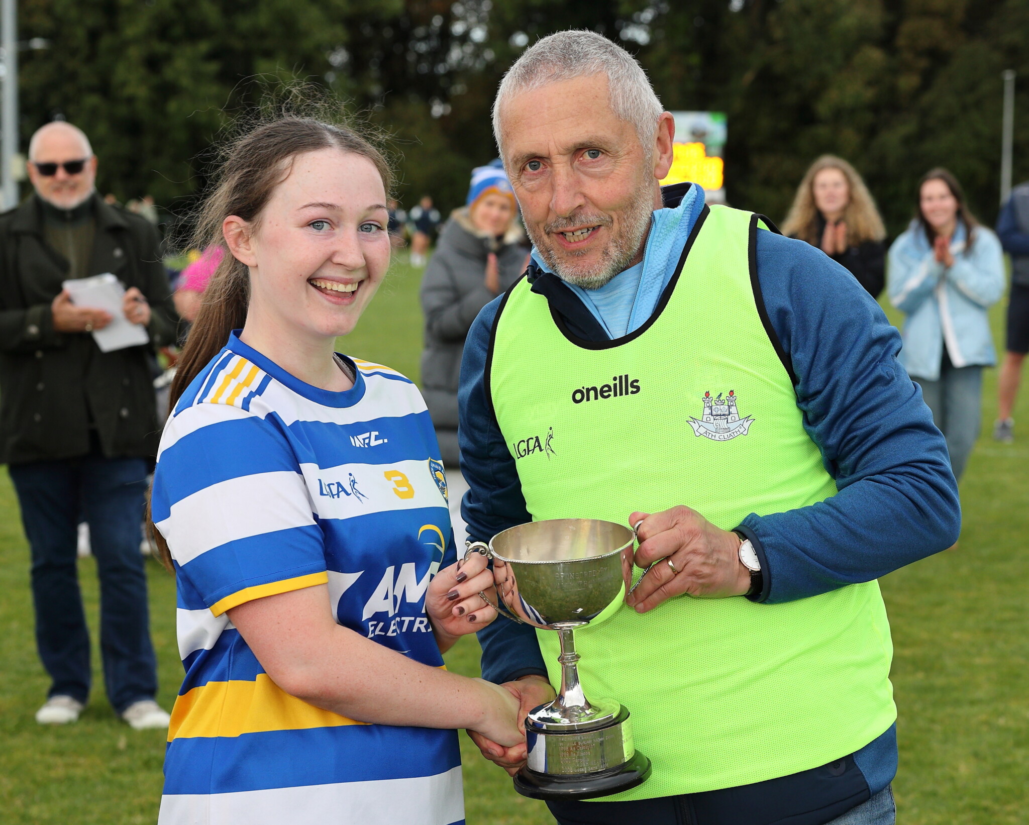Rachel Seery of Templeogue Synge St accepts the cup from Joe Keane Go ...
